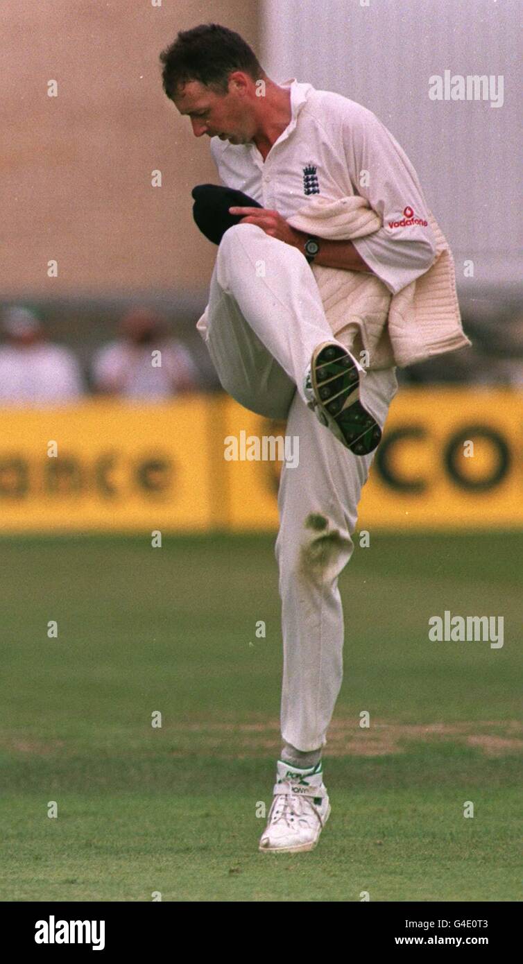 England's Angus Fraser kicks out in frustration after completing ...