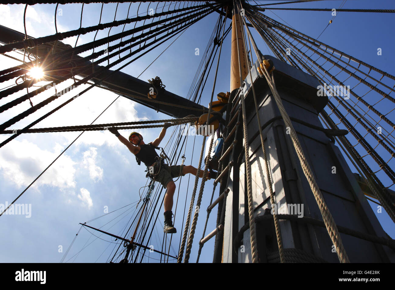 Rope access worker Jay Redman-Stainer climbs the main mast of Admiral ...