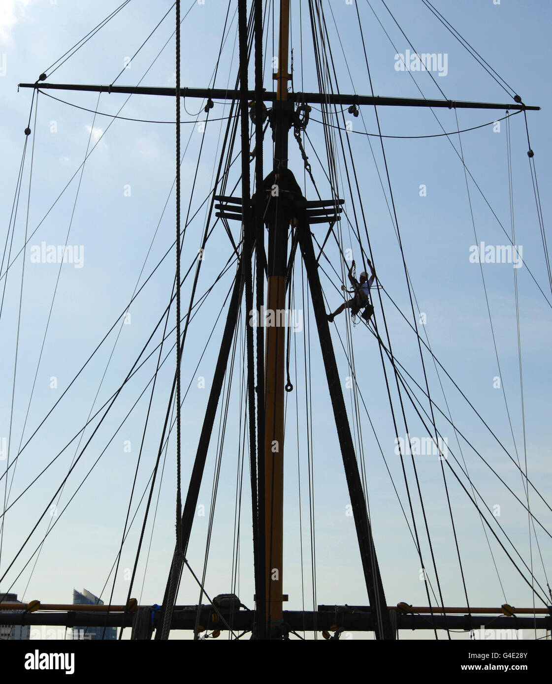 Rope access worker Rob Tucker hangs from the rigging of Admiral Lord ...