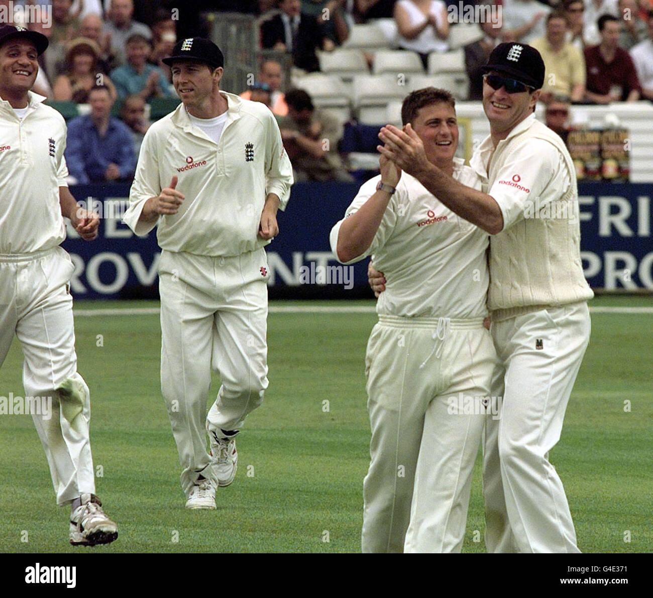 England's Darren Gough (left) and Graeme Hick celebrate the fall of ...