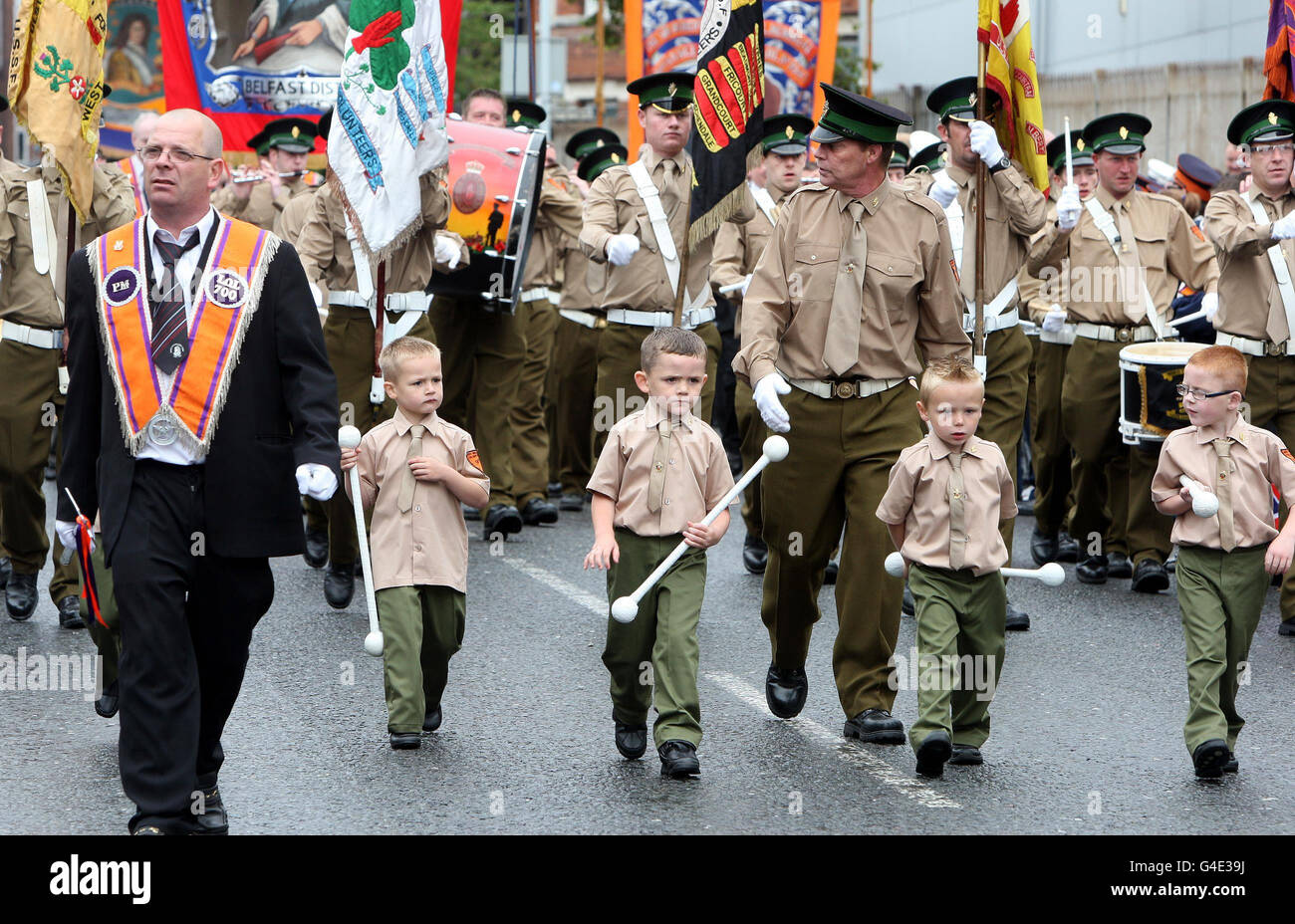 Bandsmen of the Orange Order march in Belfast as Orangemen celebrate ...