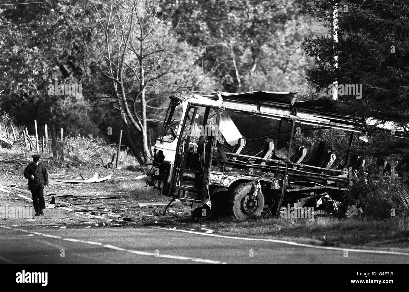 PA NEWS 21/8/88:THE SHELL OF AN UNMARKED ARMY BUS LIES AT THE ROADSIDE ...