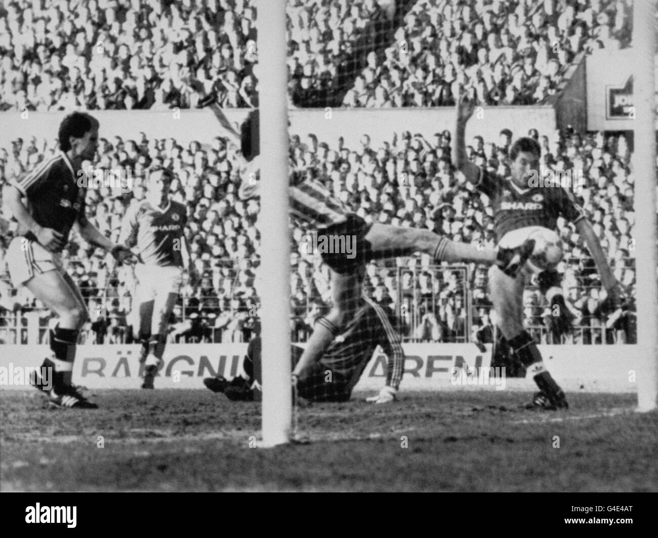 Coventry City's Keith Houchen takes the ball off Manchester United's ...