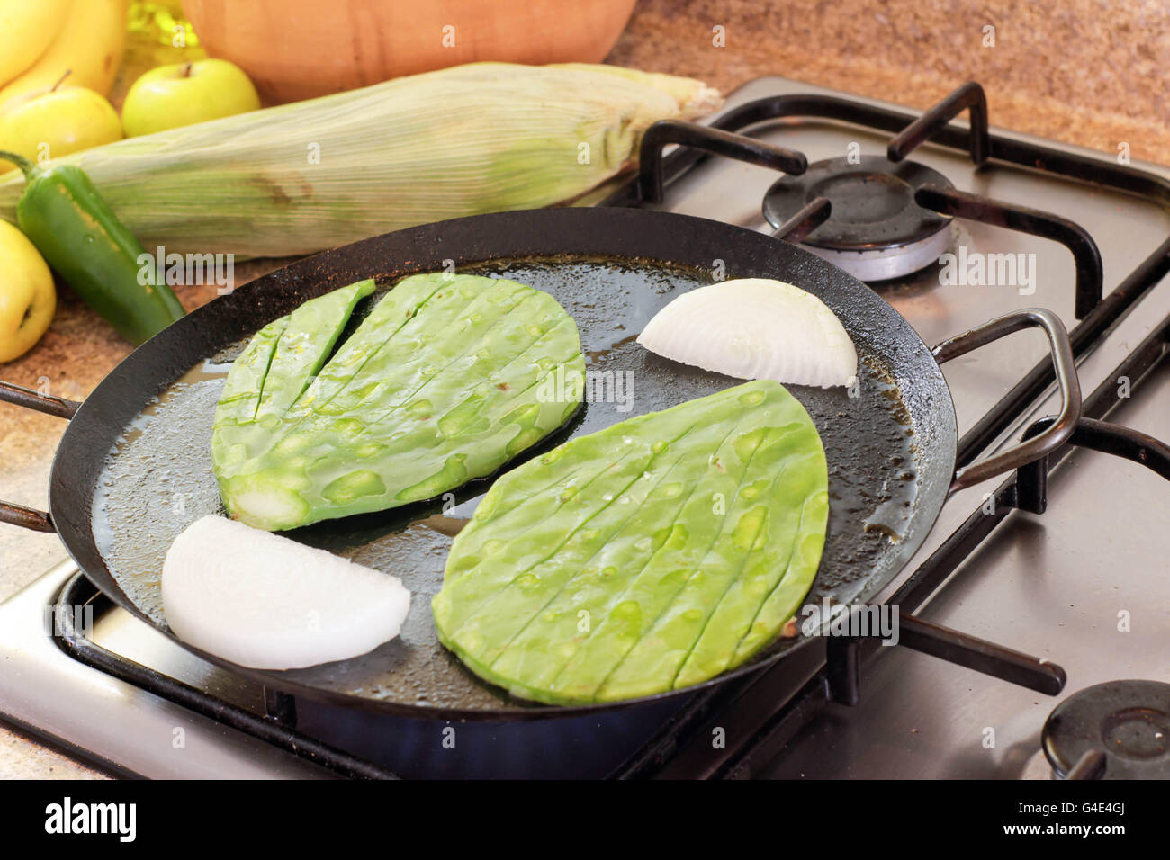 Photograph of some nopals on a hot pan on a stove Stock Photo - Alamy