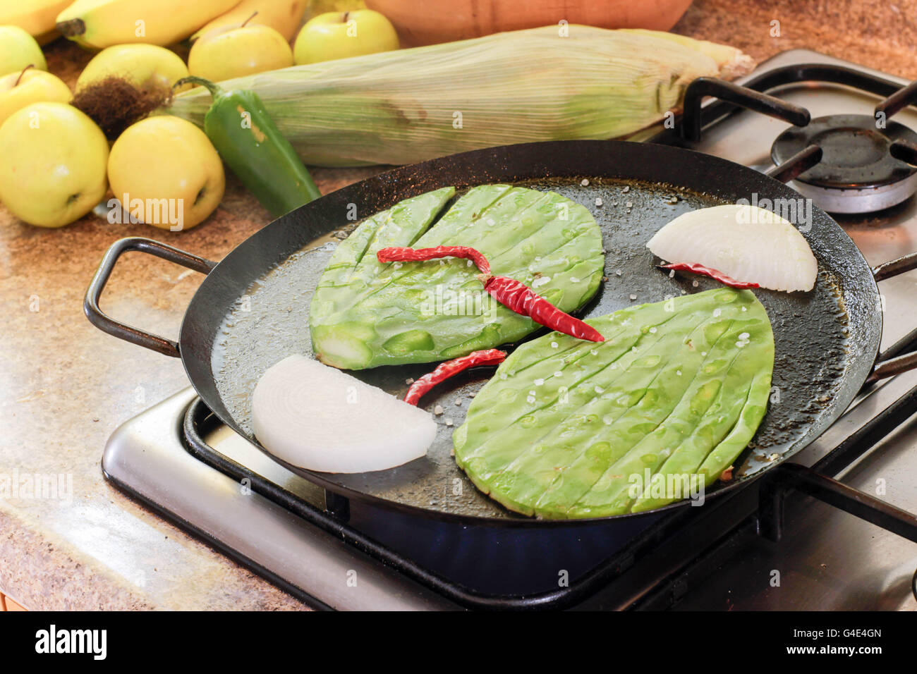 Photograph of some nopals on a hot pan on a stove Stock Photo - Alamy