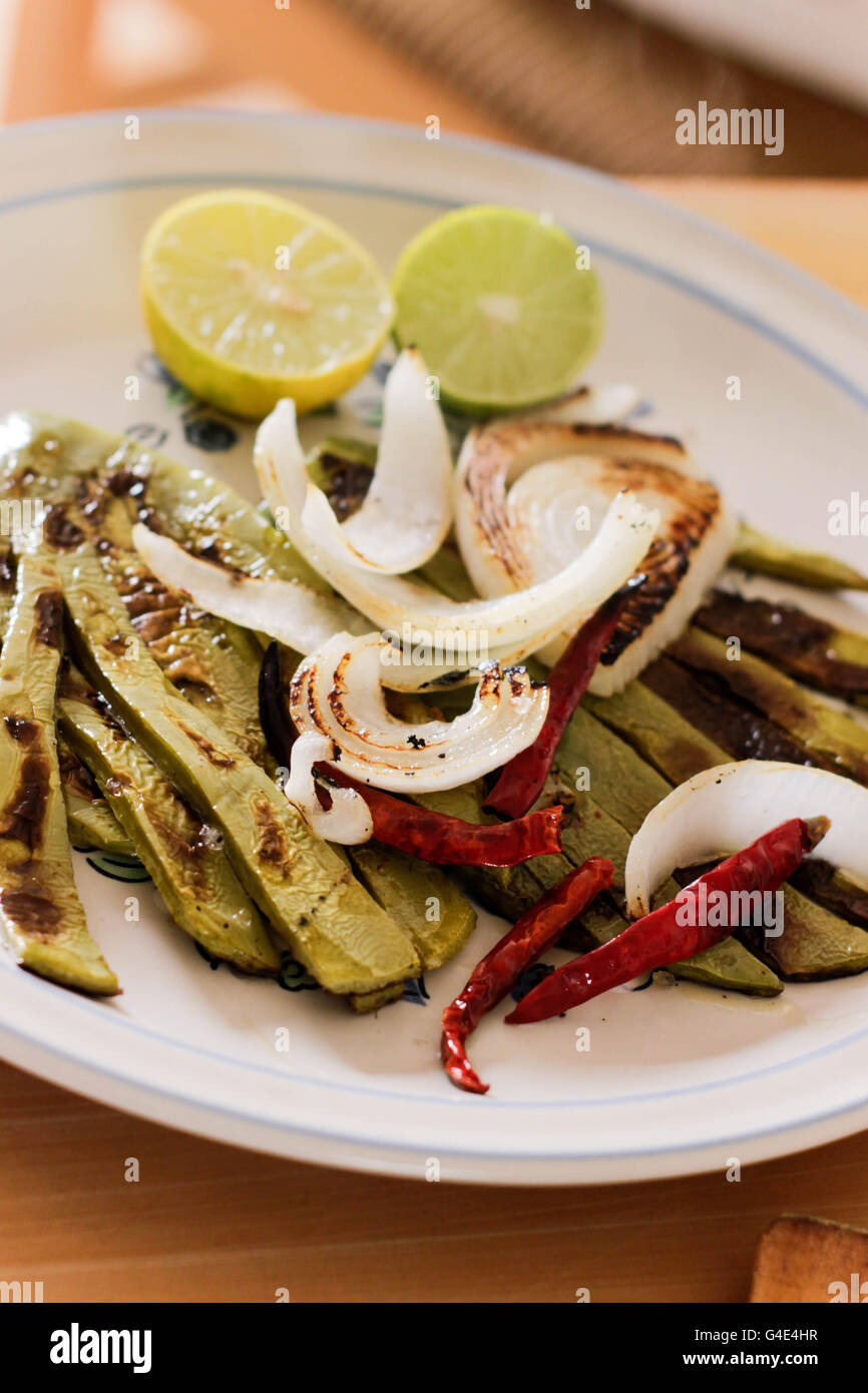 Photograph of a plate of grilled green nopals with opnion, chili and ...