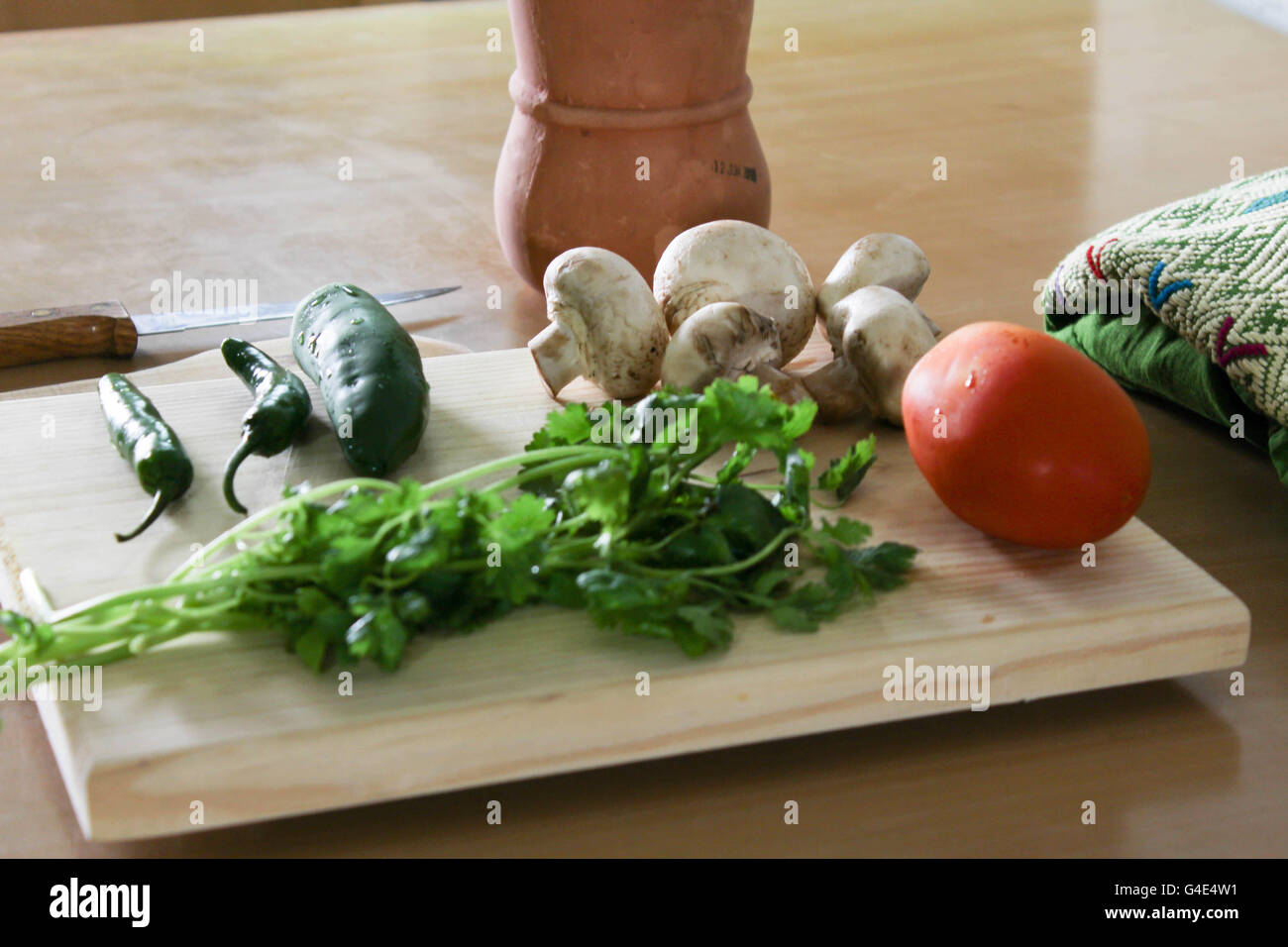 Photograph of some fresh vegetables on a wood table Stock Photo - Alamy