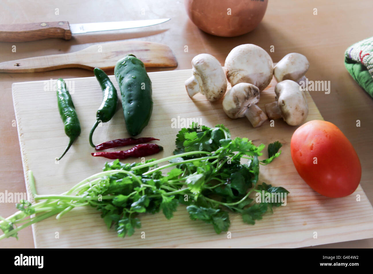 Photograph of some fresh vegetables on a wood table Stock Photo - Alamy