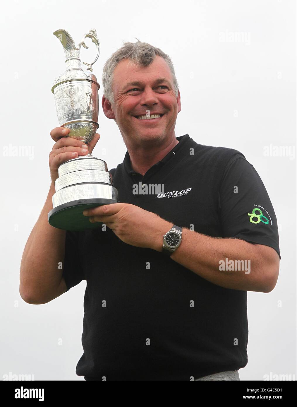 Northern Ireland's Darren Clarke poses with the Claret Jug after winning the 2011 Open ...