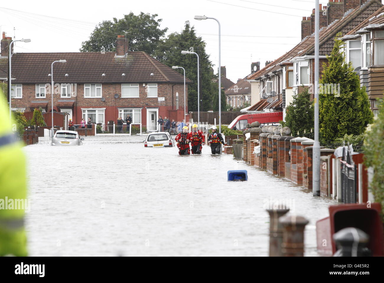 Emergency services at the scene in A road in Huyton, Merseyside, after ...