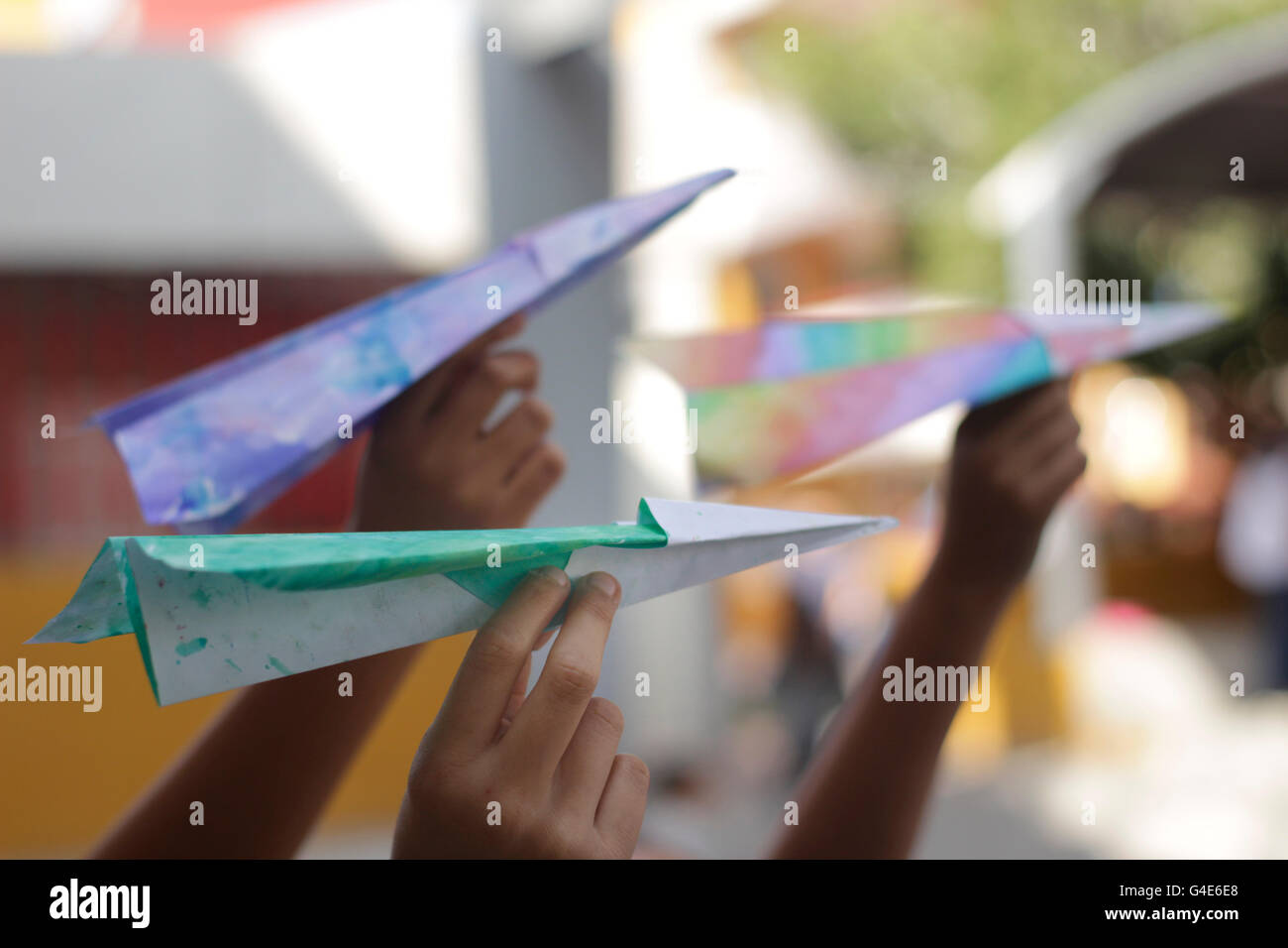 Photograph of some paper colorful planes on ready to fly on children ...