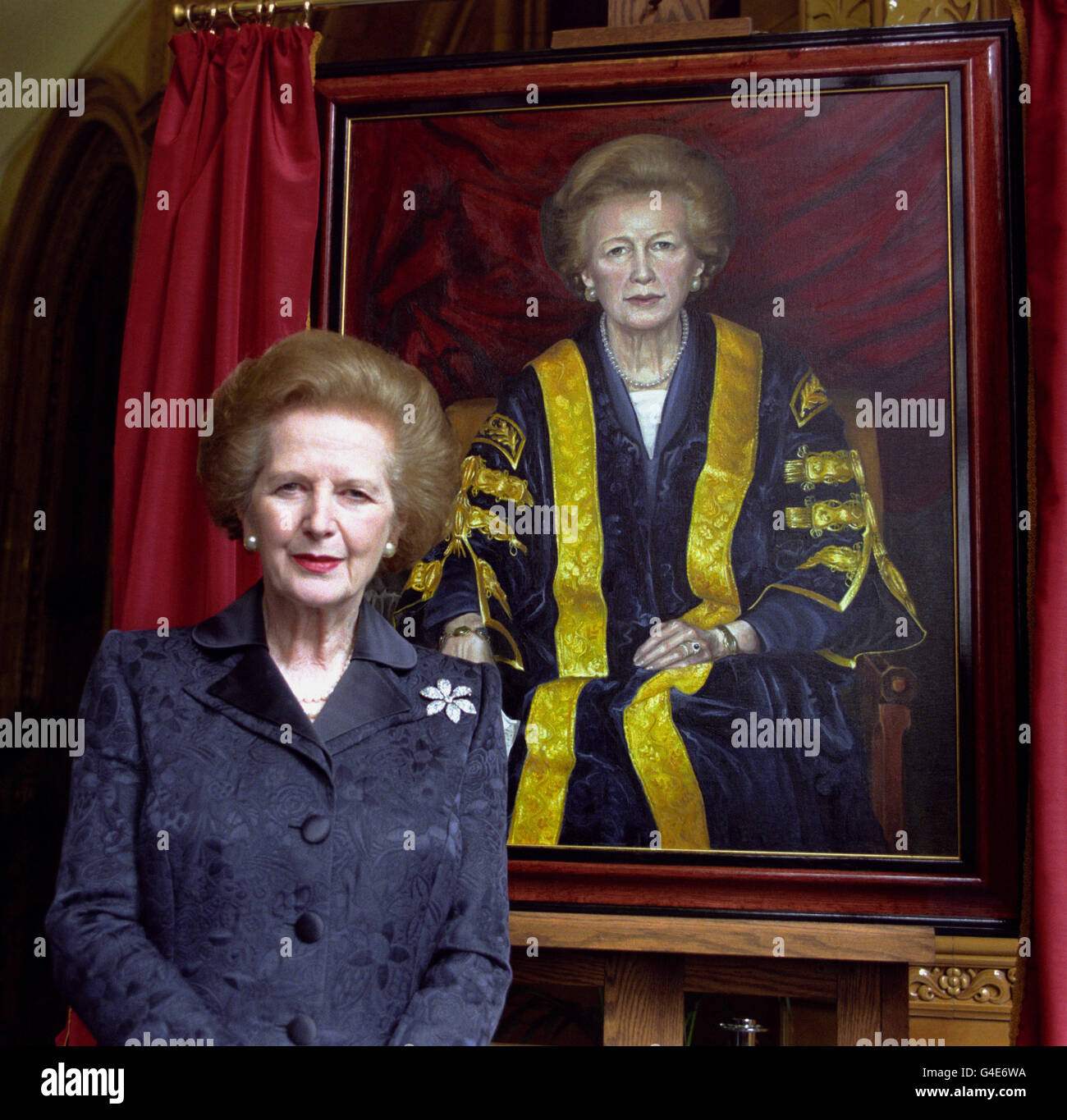 Former premier Baroness Thatcher poses with a new portrait unveiled in ...