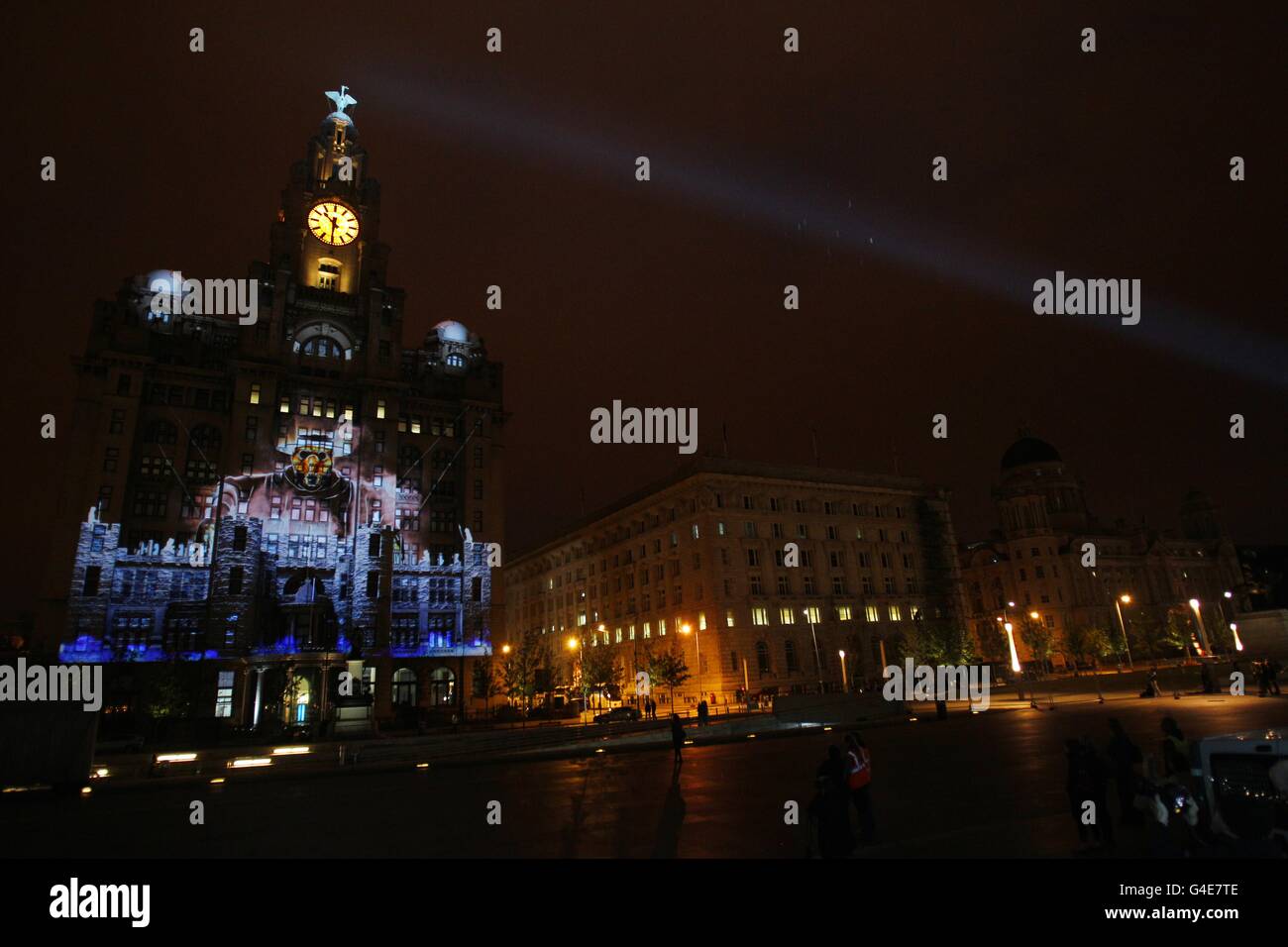 Images are projected onto the Liver Building on Liverpool's waterfront ...