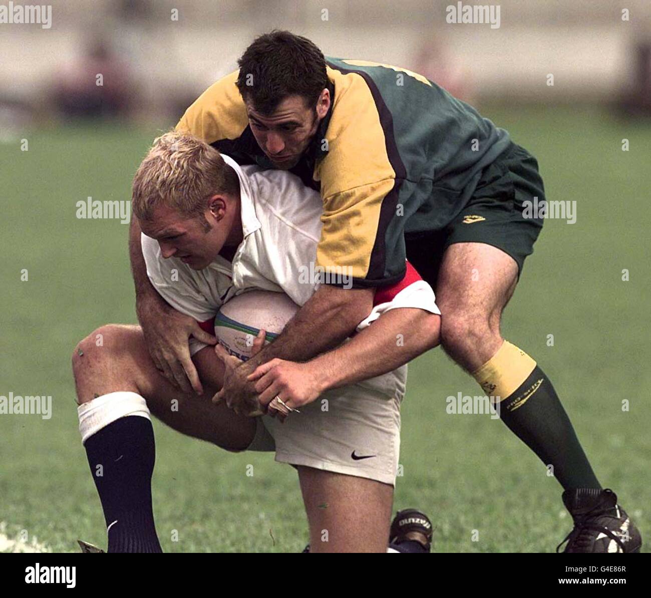 England's Mike Friday is onewhelmed by Australia's Brendan Wiliams ...