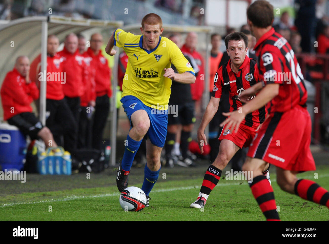 Dunfermline Athletic's Jason Thomson takes on the St Mirren defence ...