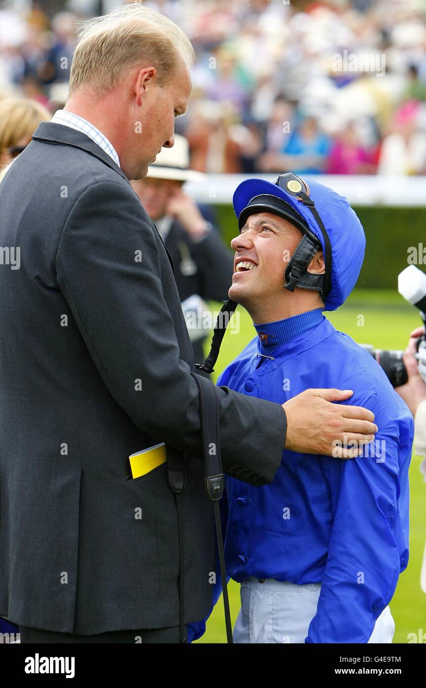 Jockey Frankie Dettori (right) speaks with horse racing trainer Ed ...