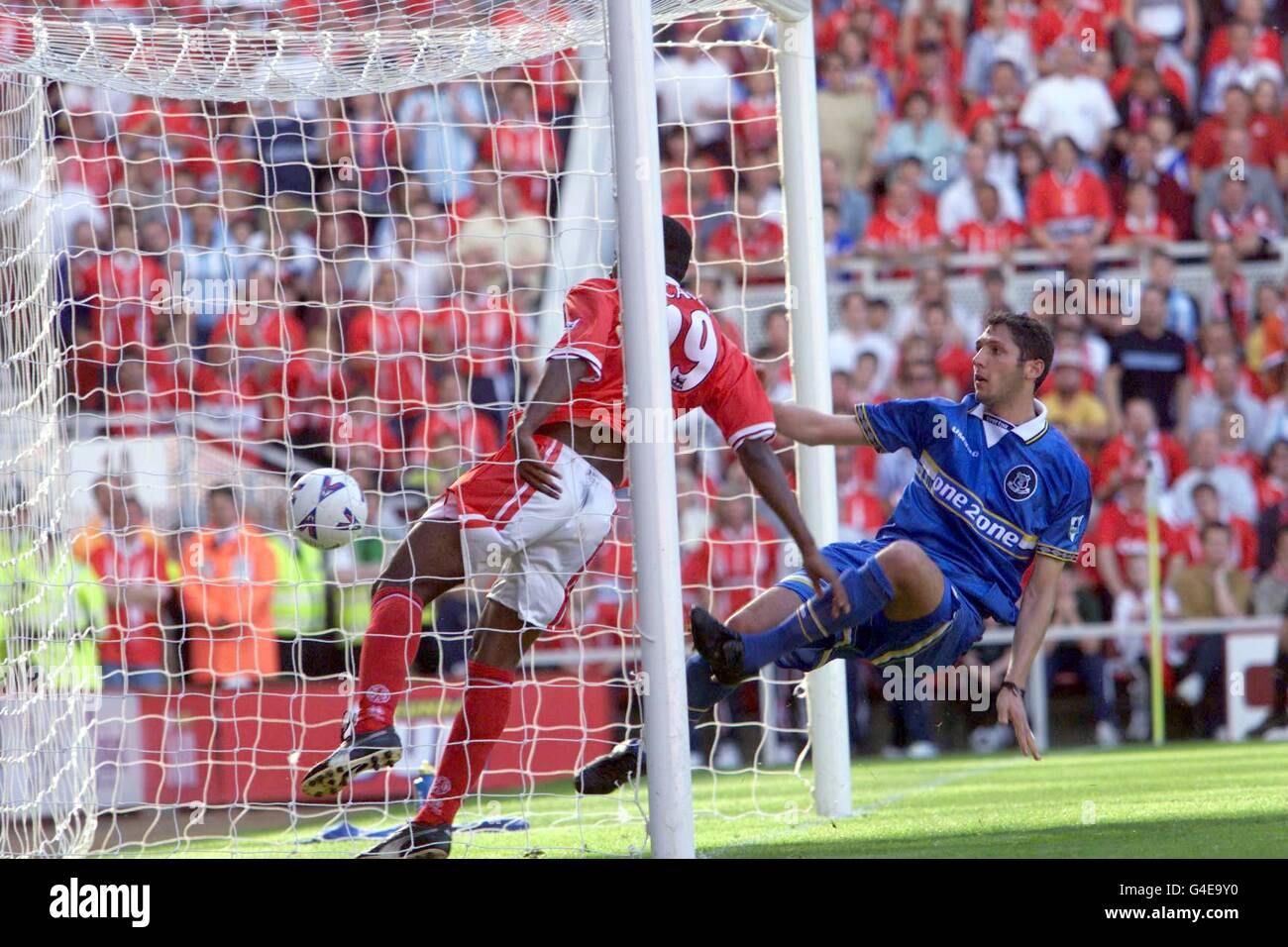 Everton's Marco Materazzi (right) can't stop Hamilton Ricard from ...