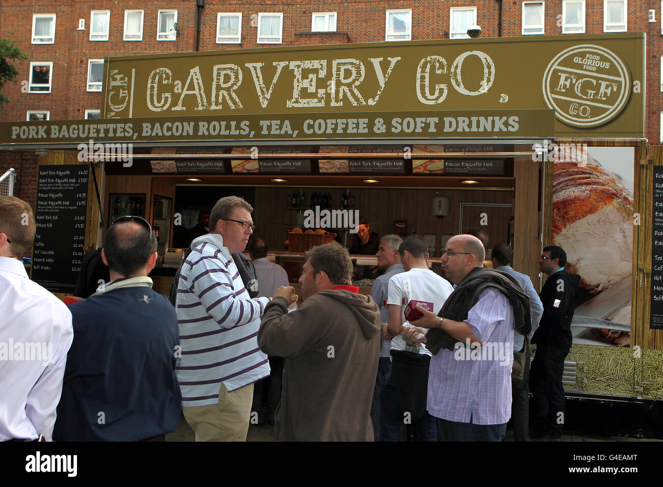 Fans queue up at a PFoog Glorious Food, food concession stand Stock ...