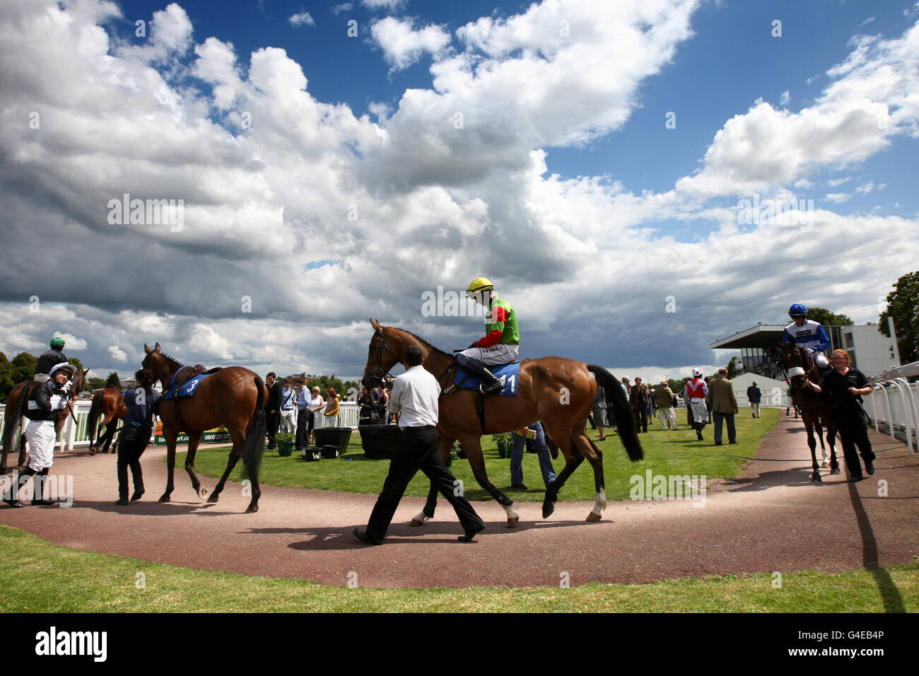 Horse Racing - Worcester Racecourse. Horses are lead around the parade ...