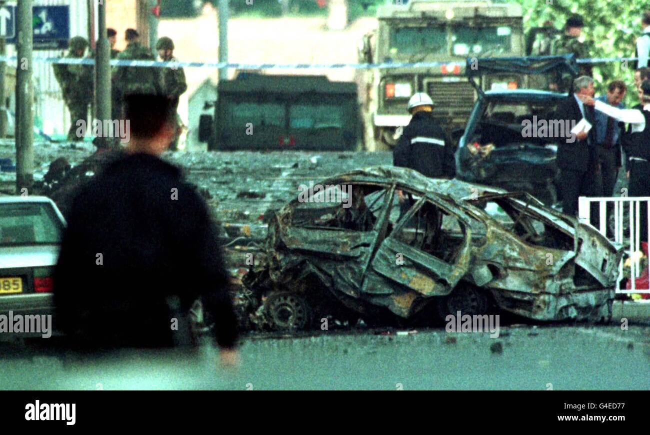 Police and fire brigade control flames after a car bomb exploded in ...
