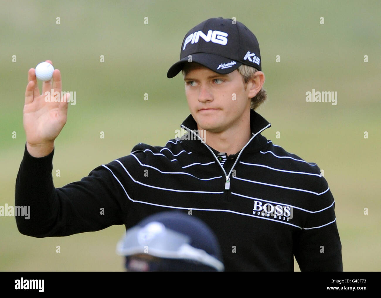 Amateur Tom Lewis of England acknowledges the crowd on the 18th green ...