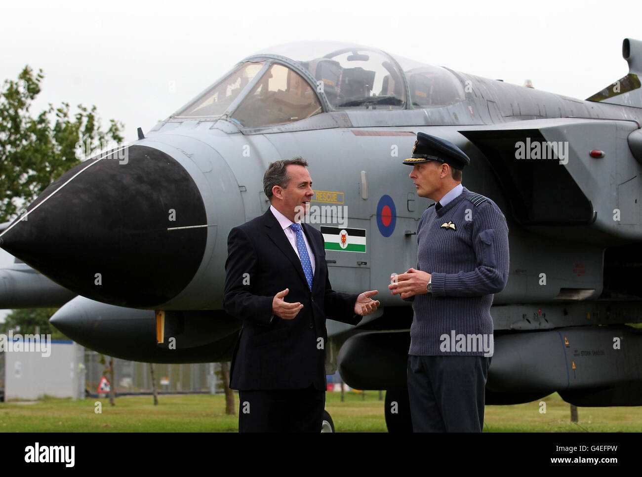Defence Secretary Liam Fox speaks with Station Commander Group Captain ...