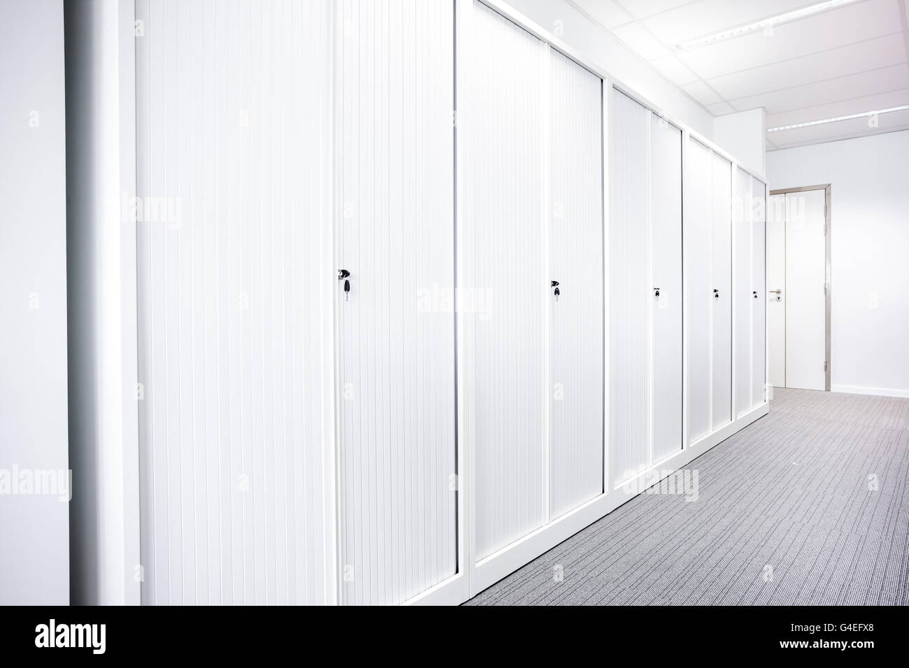 on a full row of cabinets in an empty office Stock Photo - Alamy