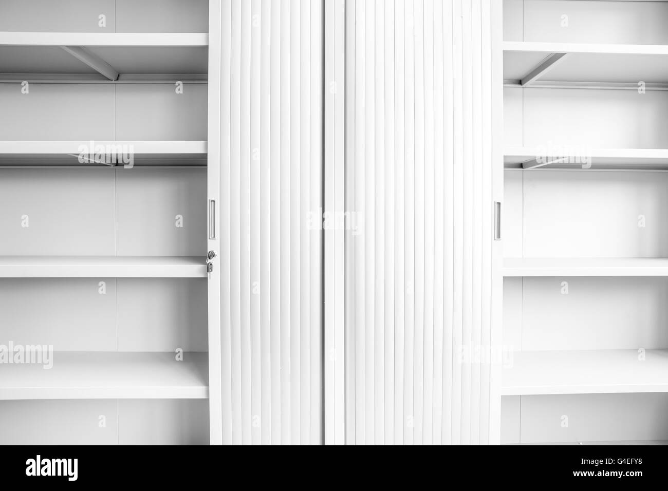 on a full row of cabinets in an empty office Stock Photo - Alamy