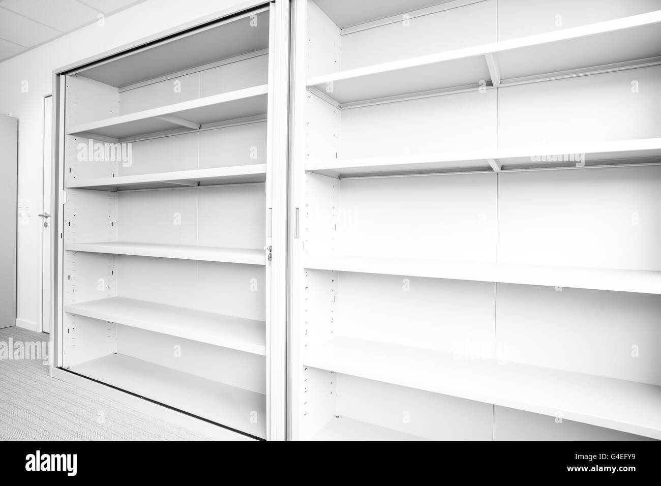 on a full row of cabinets in an empty office Stock Photo - Alamy