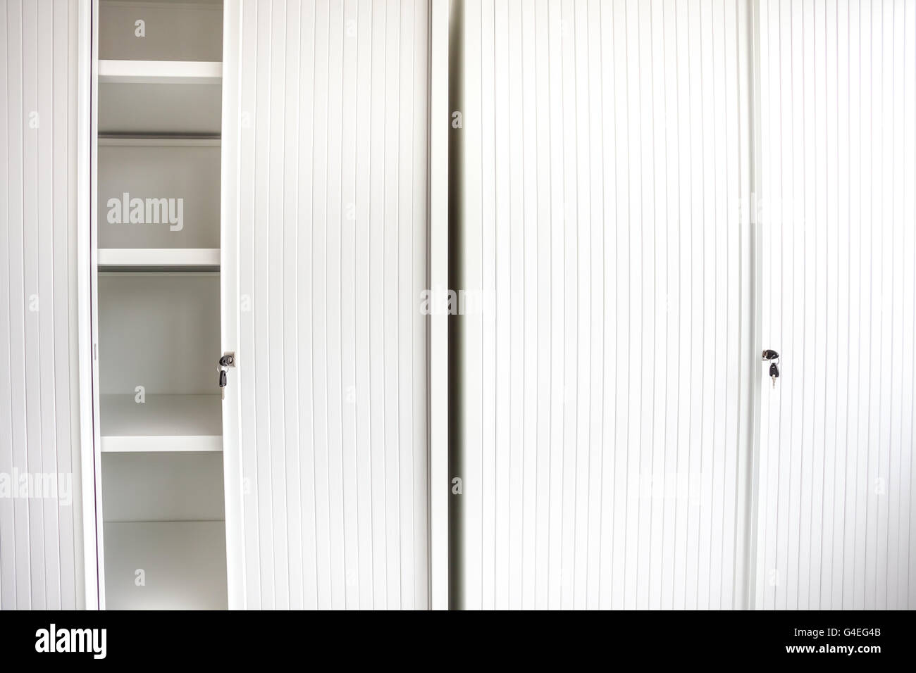 on a full row of cabinets in an empty office Stock Photo - Alamy