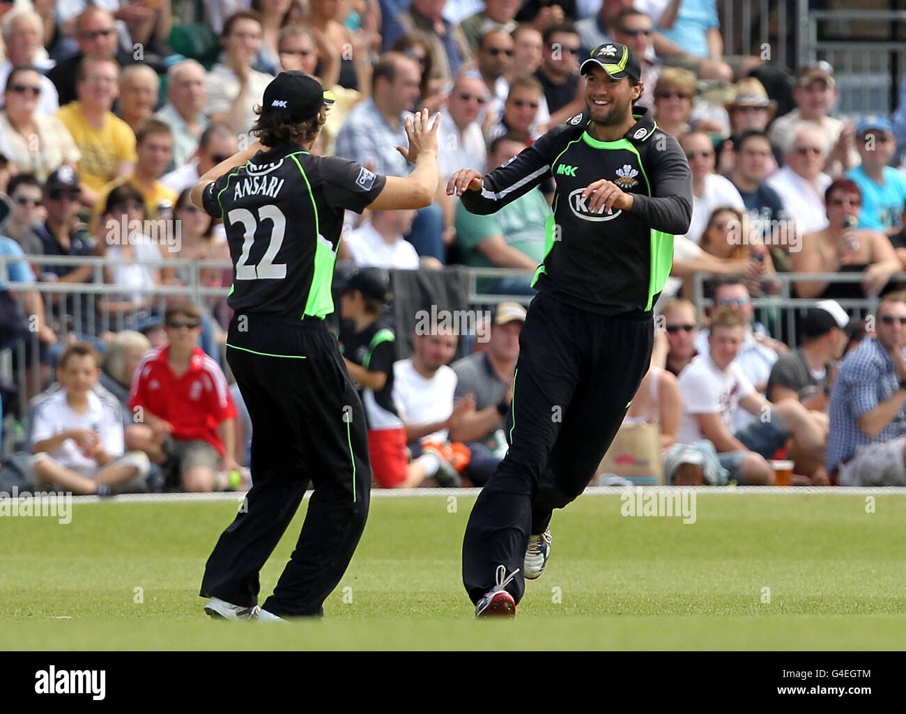 Surrey's Matthew Spriegel (right) celebrates the wicket of Warwickshire ...
