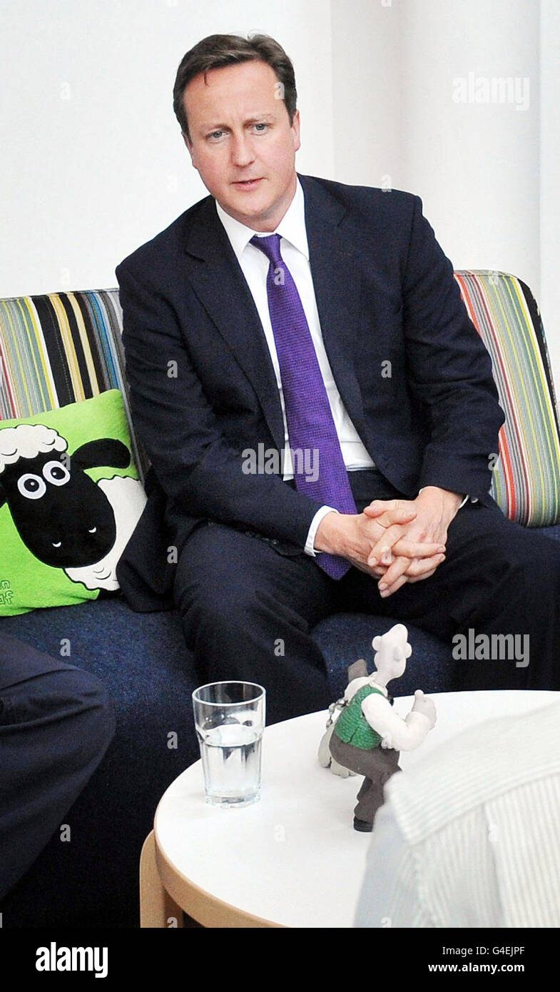 Prime Minister David Cameron speaks with animator Nick Park at the ...