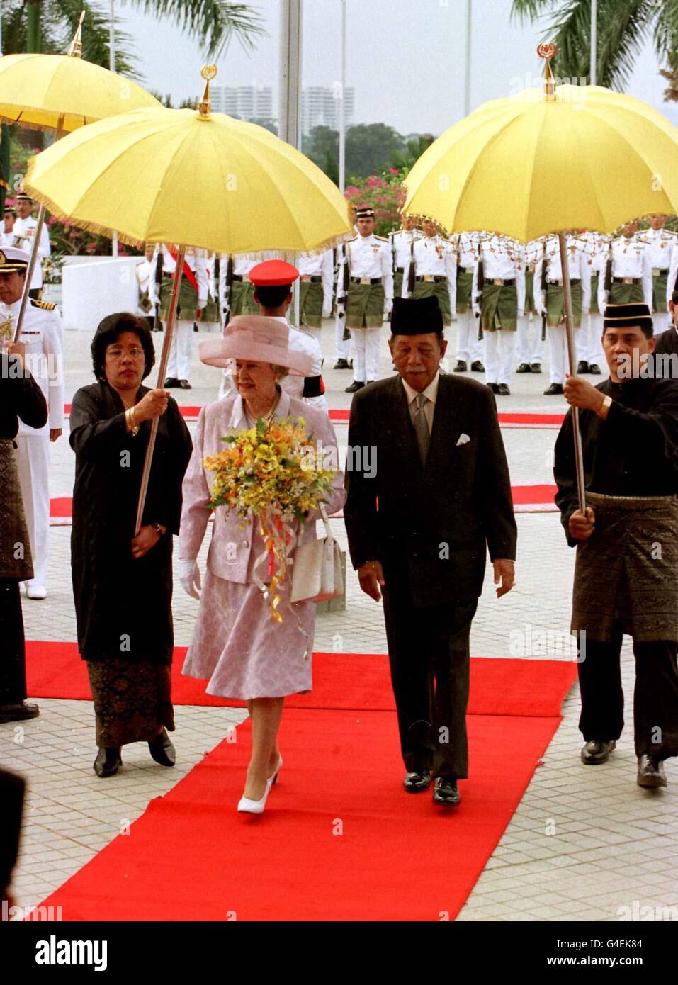 The Agong (King) Raja Permaisuri , of Malaysia accompanies the Queen at ...