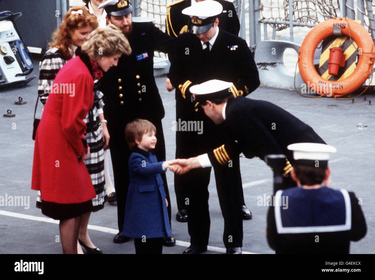 Prince William, 3, shakes hands with the Commander of the Frigate HMS ...