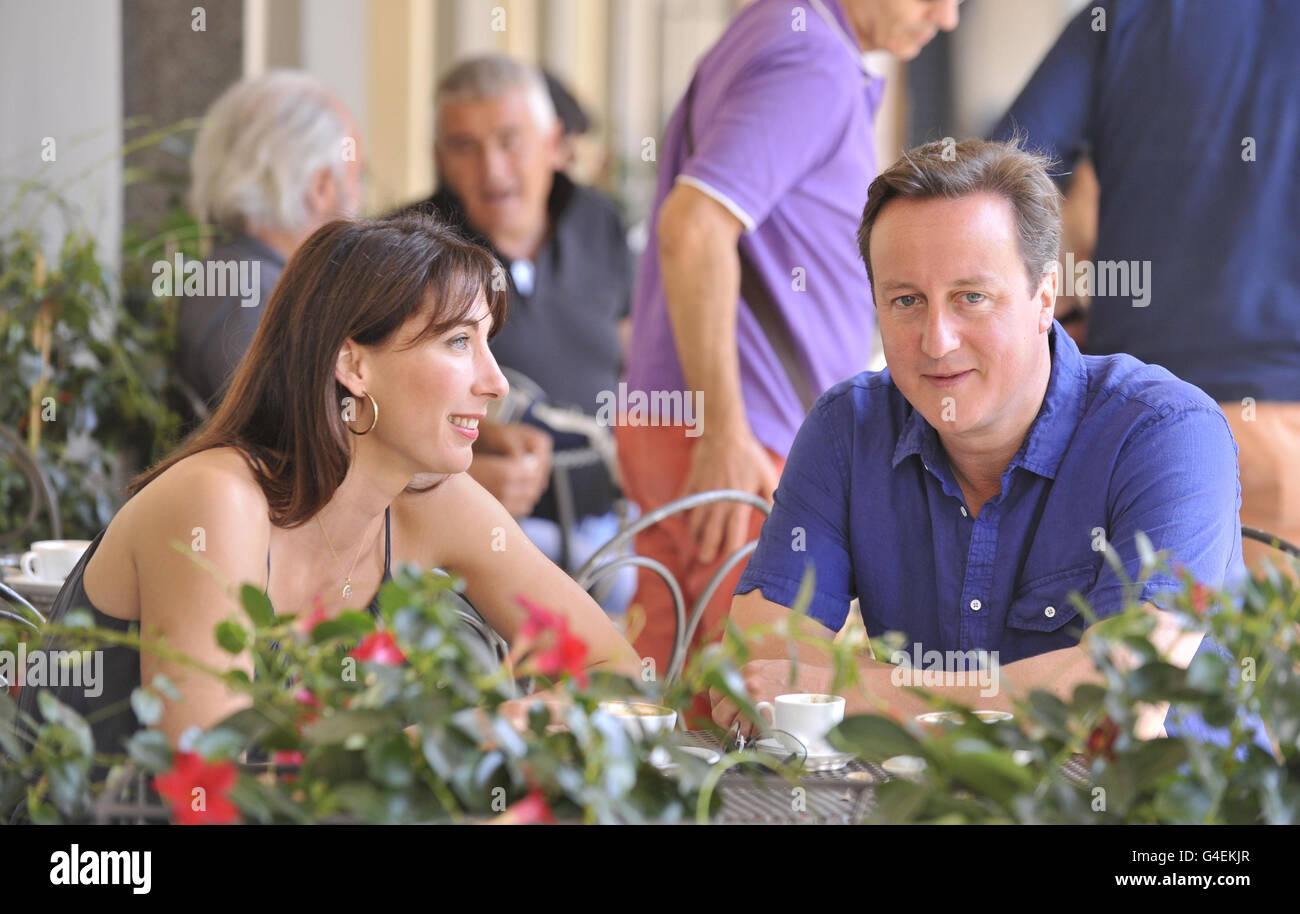Prime Minister David Cameron and his wife Samantha sit at a cafe in ...