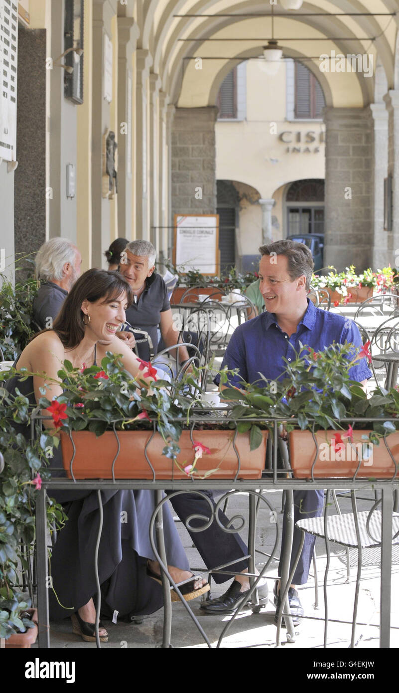 Prime Minister David Cameron and his wife Samantha sit at a cafe in ...