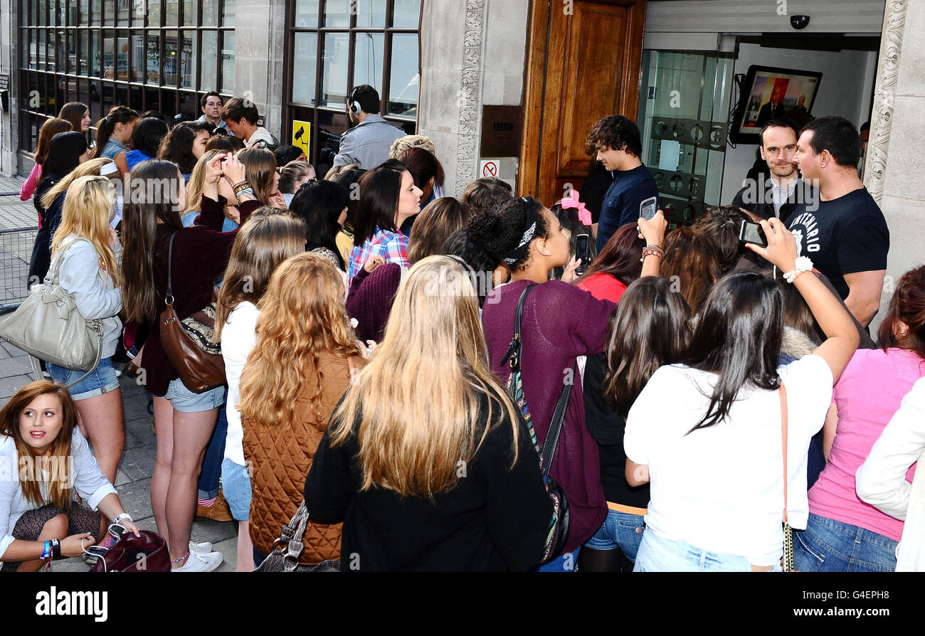 Fans queue up to meet One Direction outside Radio 1 in London Stock ...