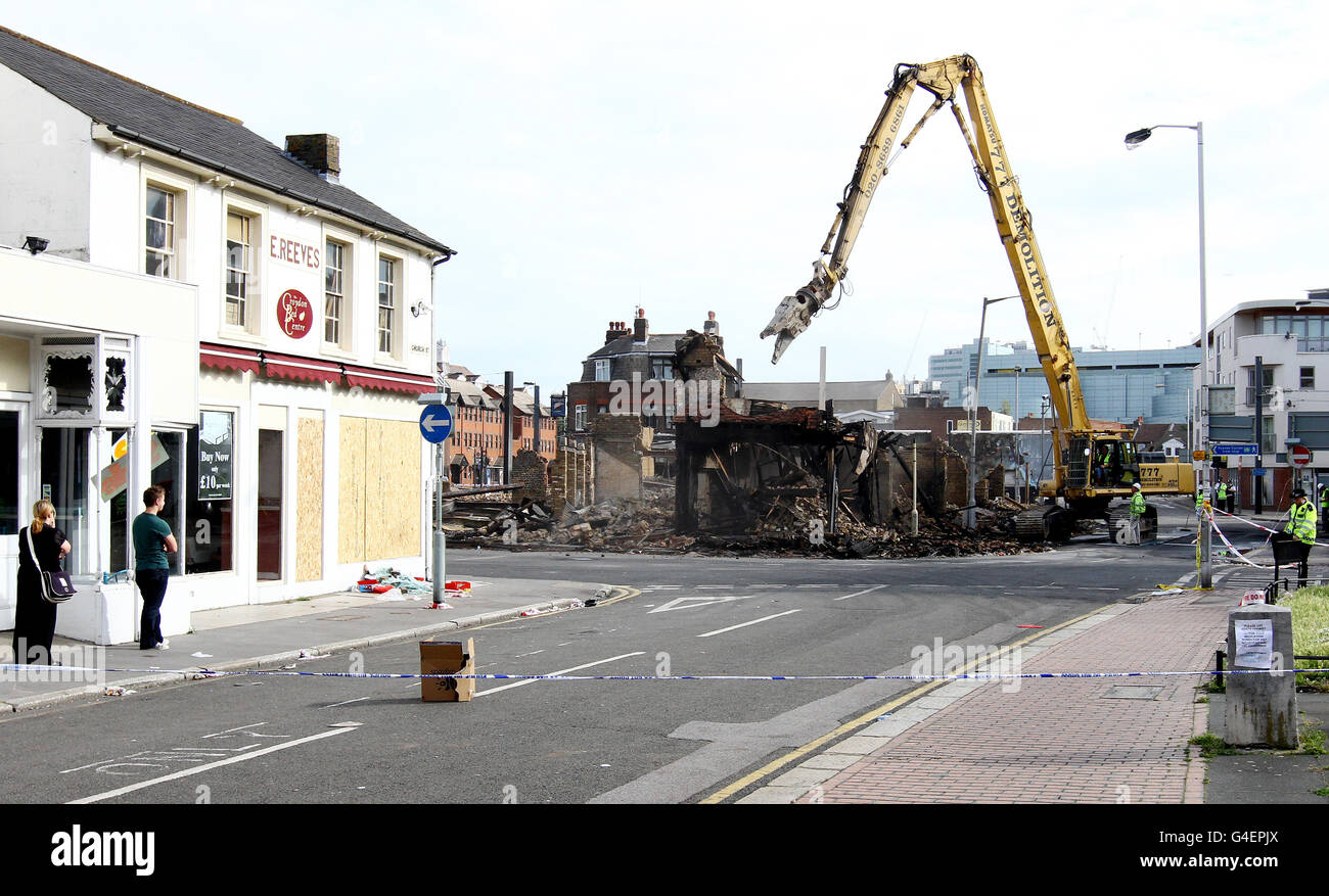 Work continues on the clear up of Reeves Furniture showroom in Croydon ...
