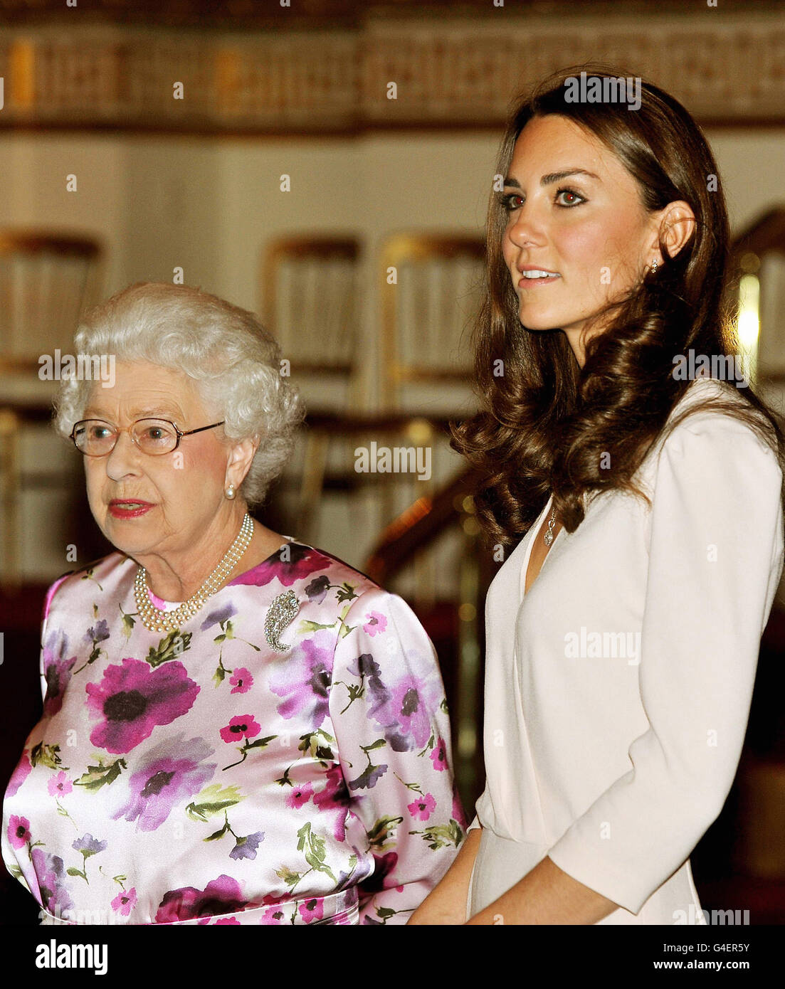 Britain's Queen Elizabeth II talks with the Duchess of Cambridge as ...