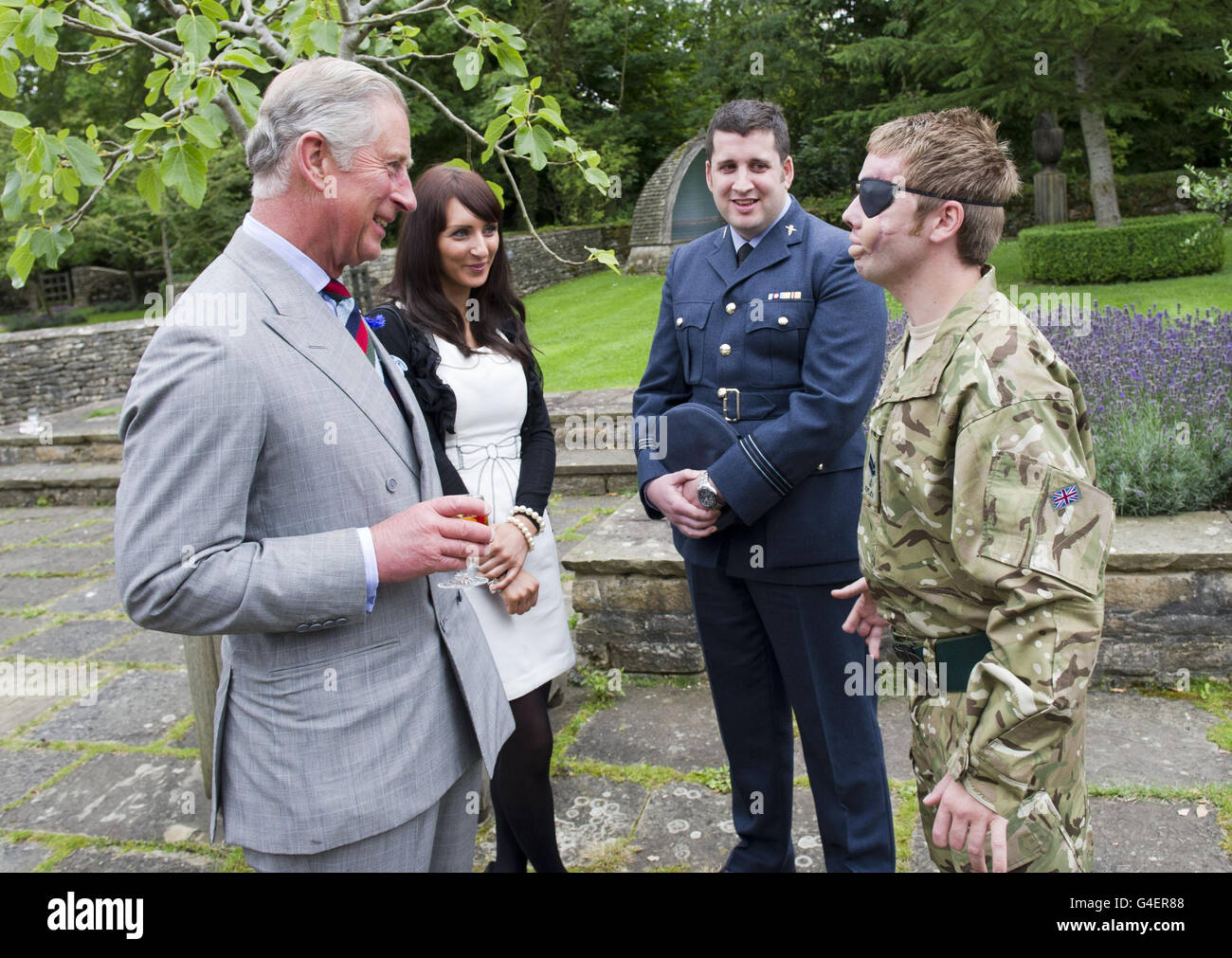 The Prince of Wales talks with Cpl Ricky Fergusson, right, who was ...