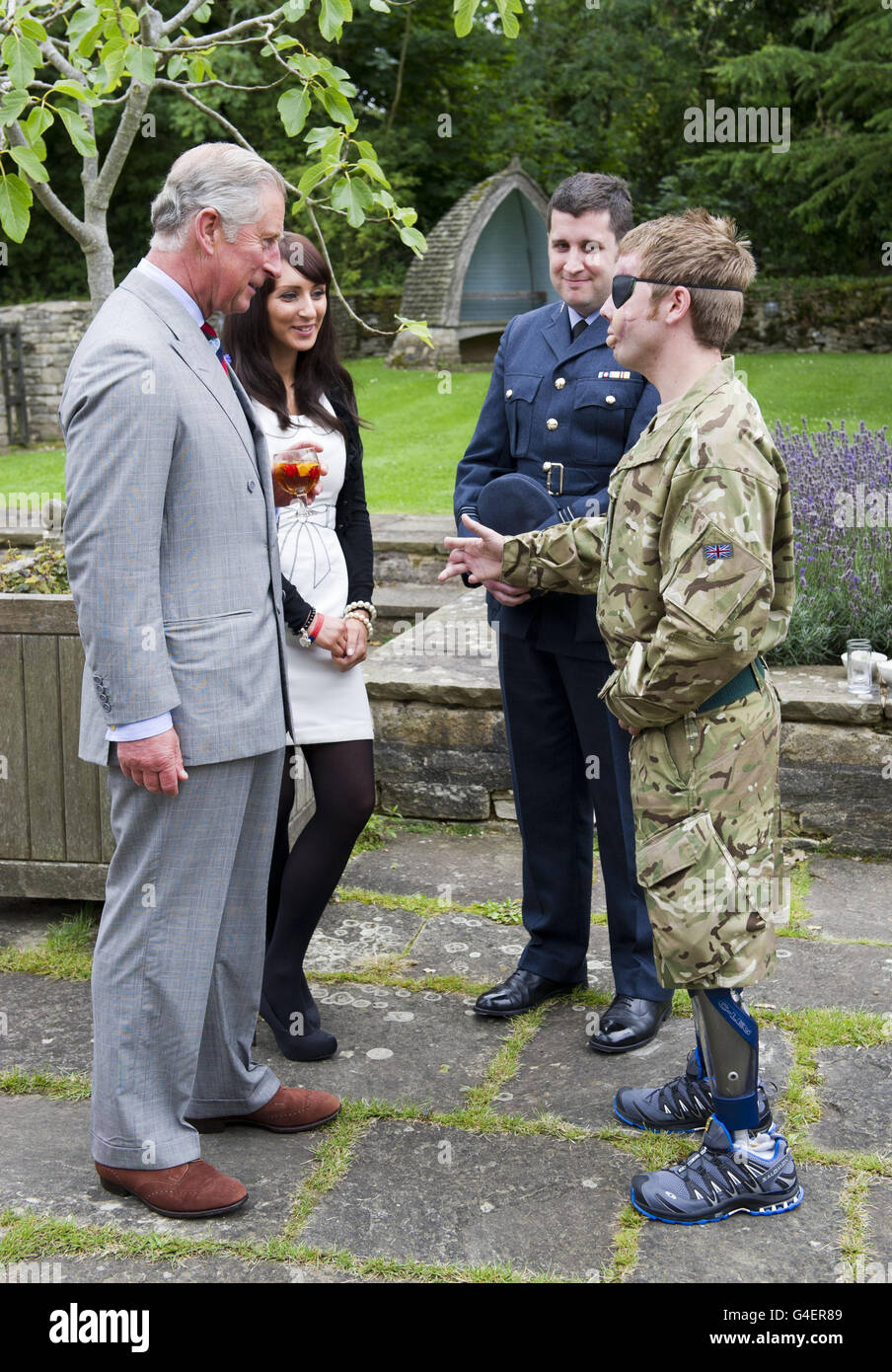 The Prince of Wales talks with Cpl Ricky Fergusson, right, who was ...