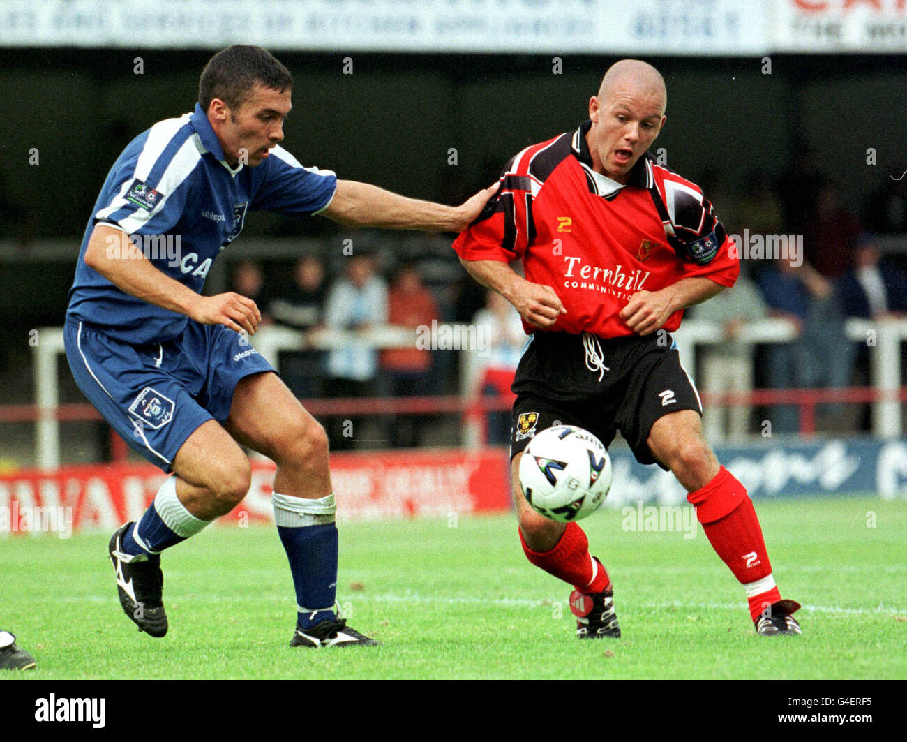 A bit of push and shove between Rochdale's (in blue) Mark Monington and ...
