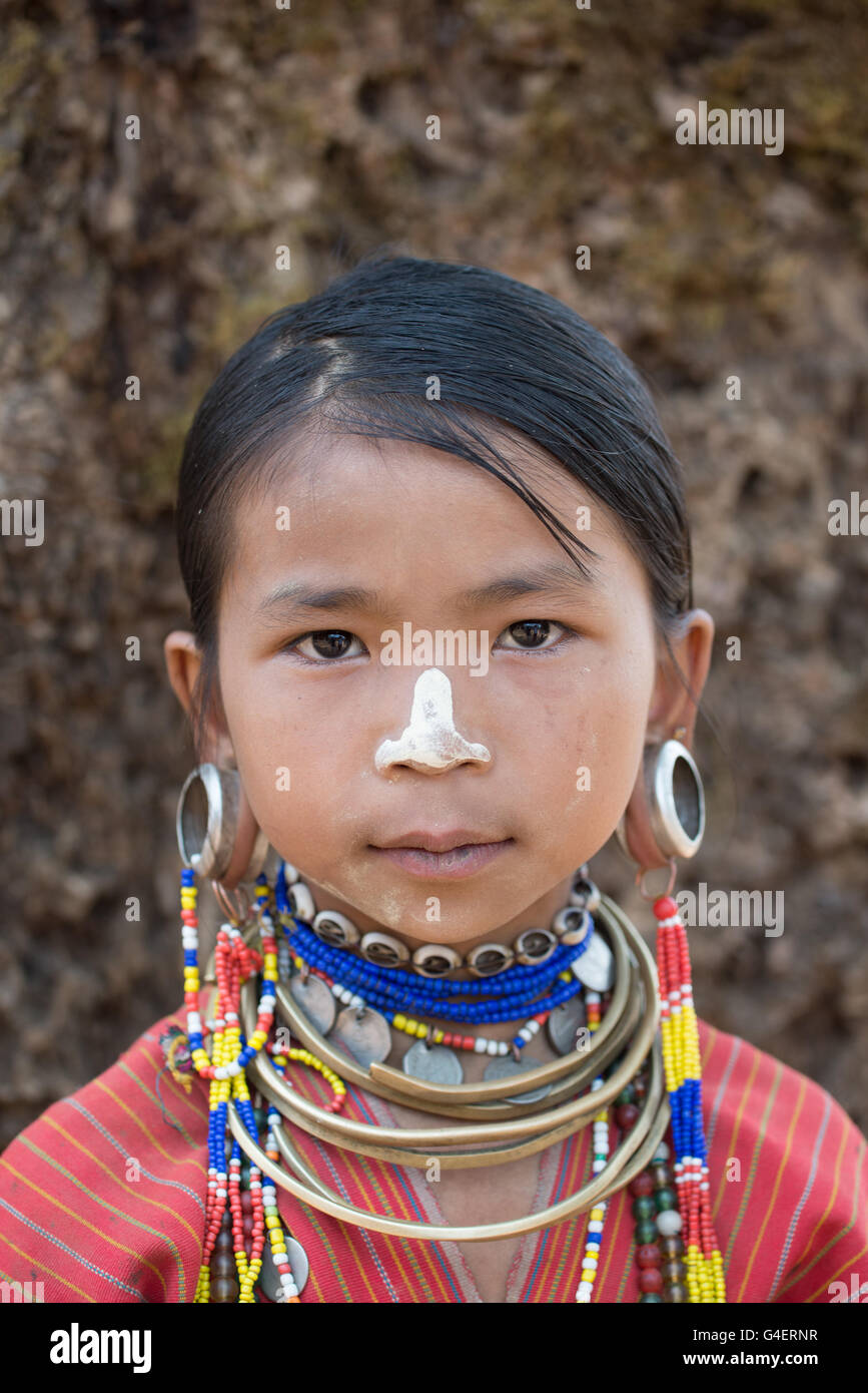 Portrait of a young Kayaw (Bwe) girl with thanaka cream on her nose ...