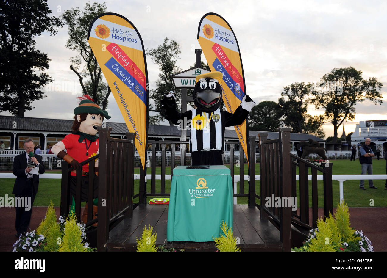 Notts County mascot Mr Magpie (centre) celebrates winning the Sunflower ...