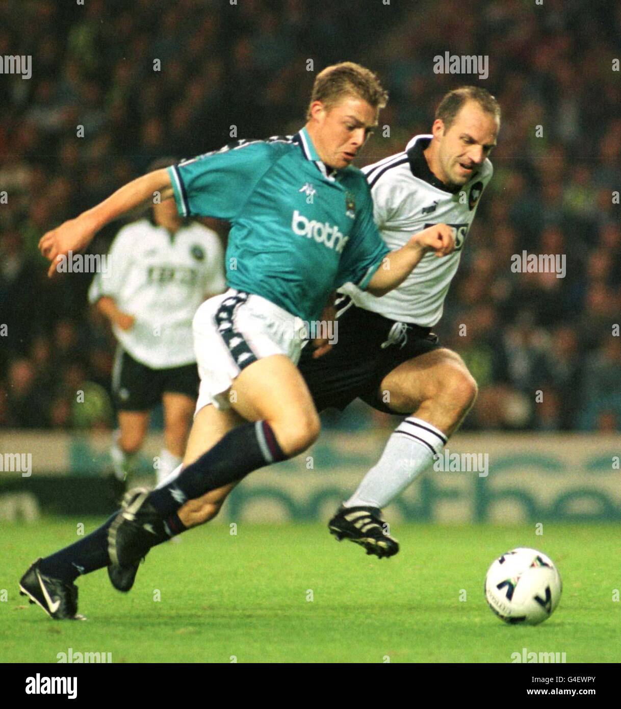 Manchester City's Daniel Allsop (left) takes on Derby County's defender ...