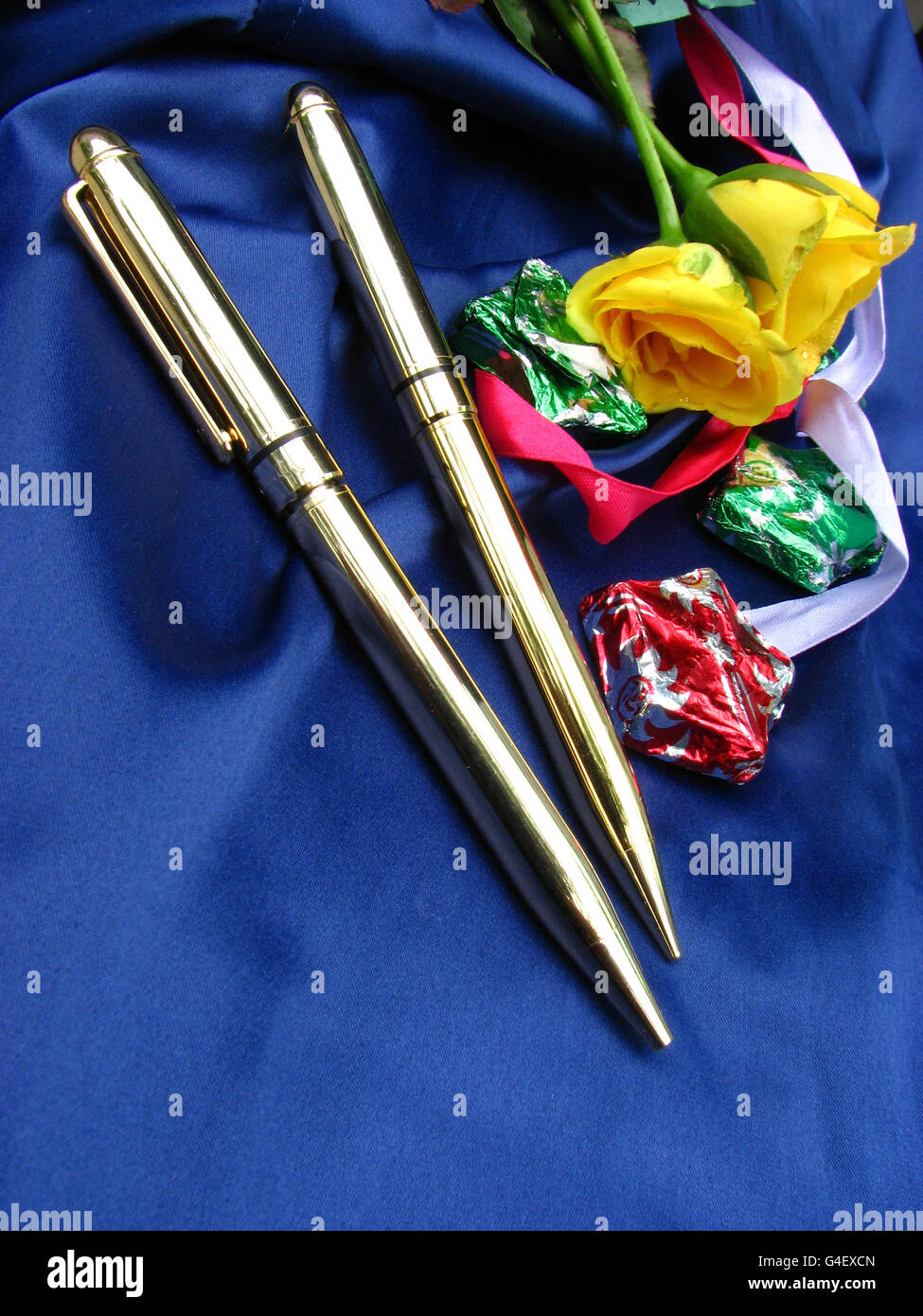 Rose and pens Stock Photo - Alamy