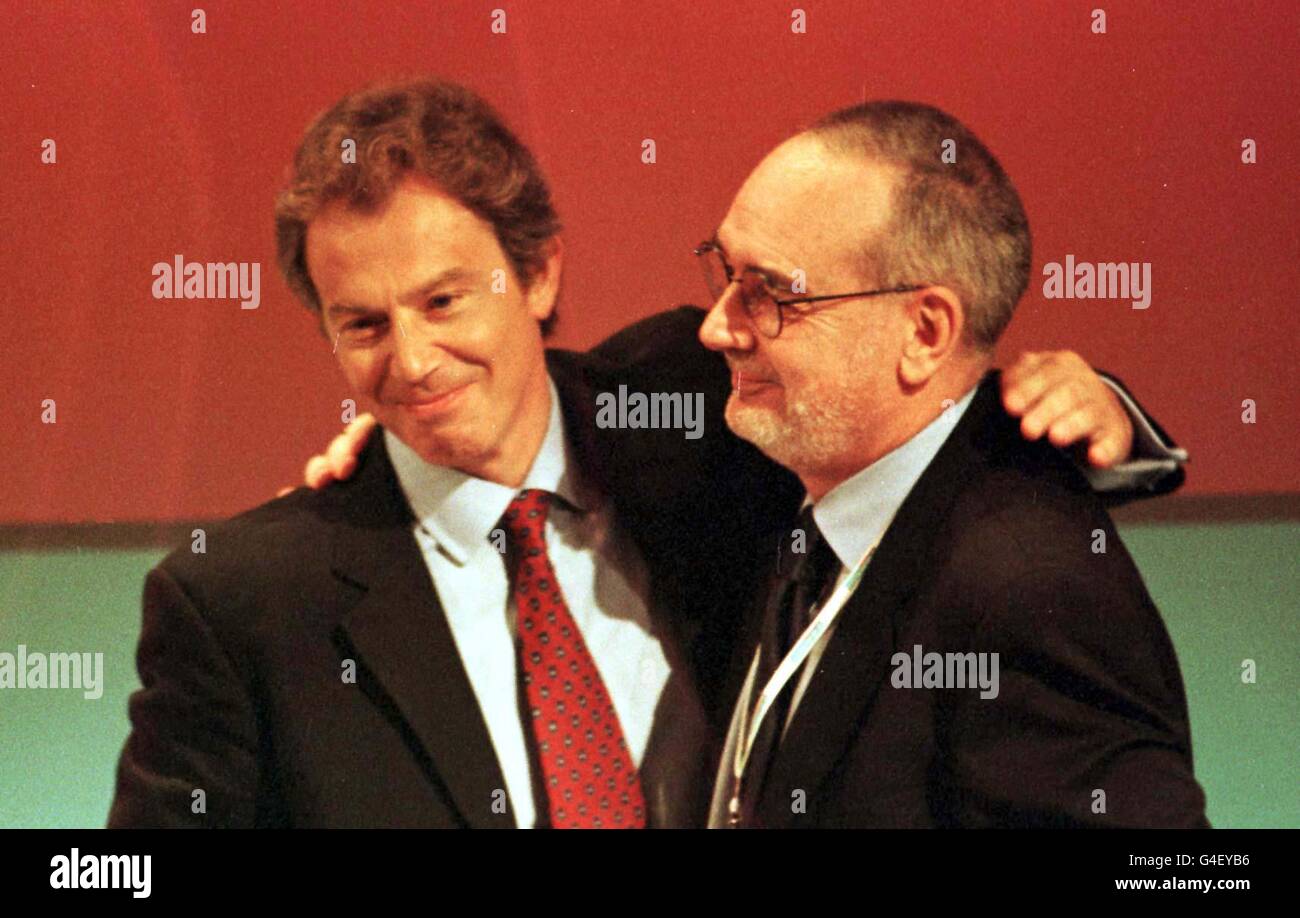 Prime Minister Tony Blair (left) embraces outgoing party secretary Tom ...