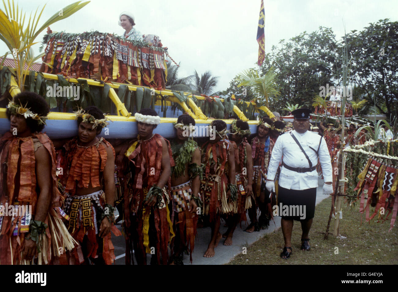Queen Elizabeth II, carried shoulder high in her canoe by islanders at ...
