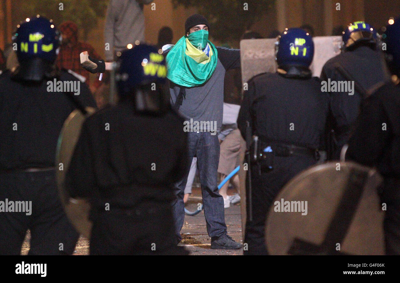 Riot police form a line in Tottenham, north London as trouble flared ...