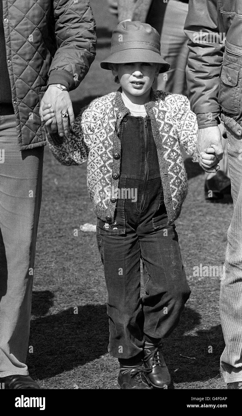 PA NEWS PHOTO 13/7/83 PETER PHILLIPS INFORMALLY DRESSED WALKS HELD BY ...